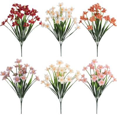 China Simulação de flor de margarida decoração de casa, casamento de orquídeas de grama de primavera, decoração de arranjos florais ao ar livre, flor falsa de plástico artificial à venda