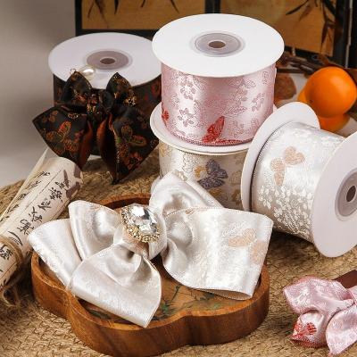 China Stil Einseitige Schmetterlingsblumenbroderie Rand Satinband Handgefertigt Bogen Kopfband Haarklemm Accessoires Blumenkrawatten zu verkaufen