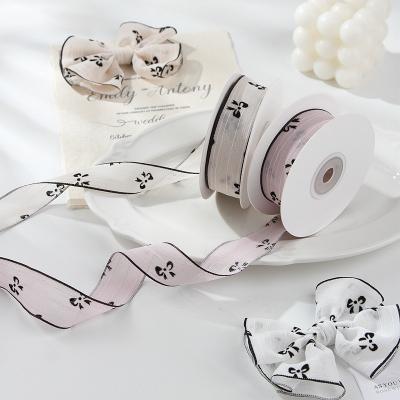 Cina Accessori per capelli con nastro di neve con stampa a farfalla in poliestere ecologico per confezioni regalo fai-da-te con fiocchi e fiori in vendita