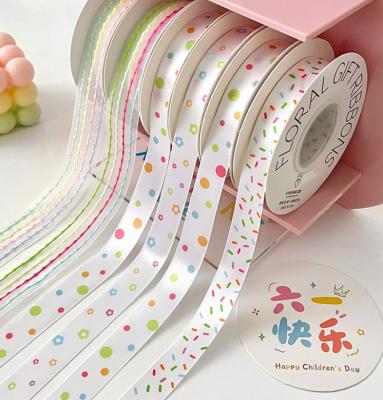 China Witte/ aangepaste kleuren Internationale kinderdag snoep Cacao lint Bloem boeket Boog stropdas Bloem Handwerk DIY materiaal Te koop