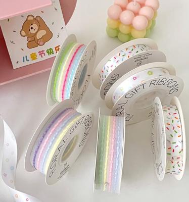 China Witte/ aangepaste kleuren Internationale kinderdag snoep Cacao lint Bloem boeket Boog stropdas Bloem Handwerk DIY materiaal Te koop
