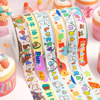 Cina Nastri stampati a cartoni animati ecologici da 1,5 cm: l'aggiunta perfetta per le decorazioni fai-da-te fatte a mano per la Giornata Internazionale dei Bambini in vendita
