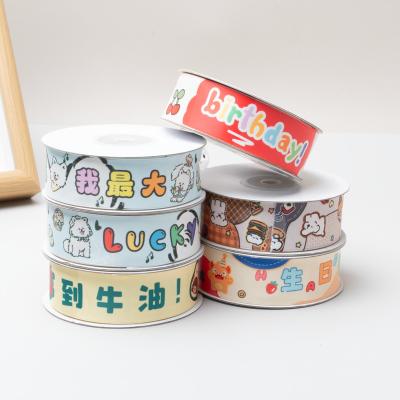 Cina Nastri stampati a cartoni animati ecologici da 1,5 cm: l'aggiunta perfetta per le decorazioni fai-da-te fatte a mano per la Giornata Internazionale dei Bambini in vendita
