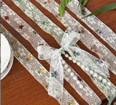 Cina Nastro di pizzo verde da 2,5 cm/10 m, materiali floreali per il bouquet di garza di bellezza del giorno di San Valentino Qixi in vendita