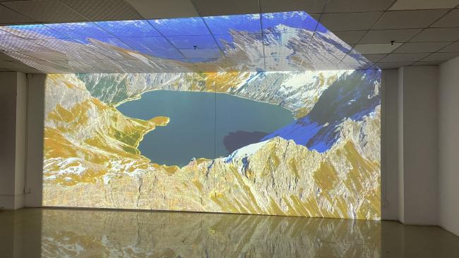 SMX MX-VL650U projector displaying bright image in large venue