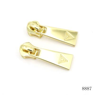China Engraved Metal Zipper Puller OEM Zipper Pulls For Bags And Handbags for sale