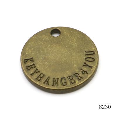 China 23.5mm Round Antique Brass Circle Label Tag Custom Engraved Metal Charm Logo Tag for Branding for sale
