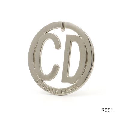 China Popular Circle Hollow Letter Metal Charm Custom Logo Tag For Keychain Purse for sale