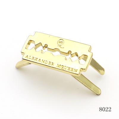 China Gold Plated Custom Hollow Metal Logo Tag With Two Prongs For Handbag Purse for sale
