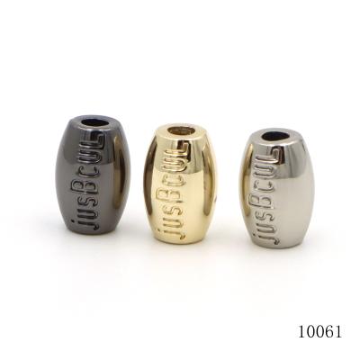 China Light Gold And Nickle Plated Zinc Alloy Metal Rugby Shape Beads With Engraving Logo for Bracelet for sale