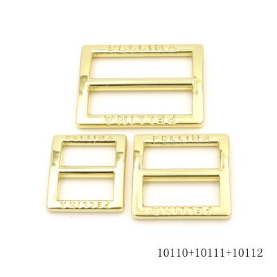 China Gold Plated Metal Tri-glider Buckle 32mm Strap Adjusters Custom Logo Slider Buckles for sale
