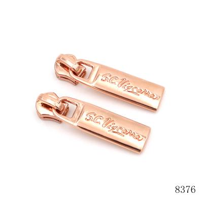 China Top Quality Custom Rose Gold Logo Engraved Metal Zip Puller Tag For Handbags Hardware Accessories for sale