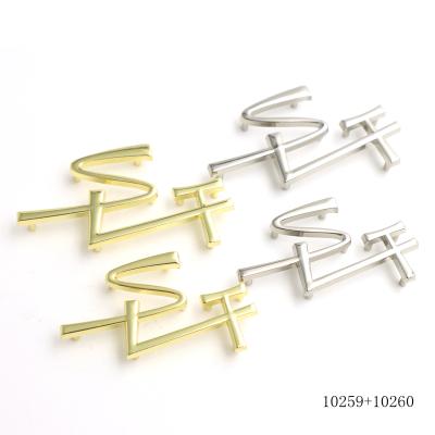 China Custom Monogram Letter Logo Plate Interlocking Letters  Metal Badge for Luxury Handbag Hardware for sale