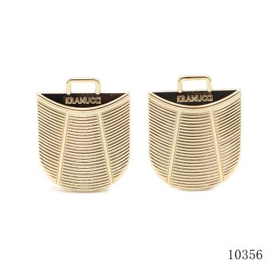 China Custom shield shape metal hanging emblem zinc alloy made bag metal logo tag for sale