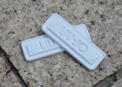 China Degradable 2mm garment TPU Clothing Labels With Mould Embossed Logo for sale
