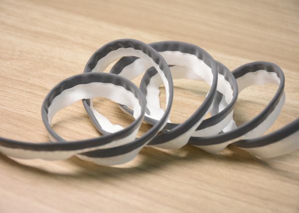 Customised Reflective Piping Tape Sewn Into Garment