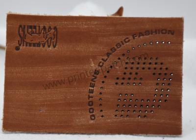 China Brown PVC TPU Stitched On Jeans Leather Label SGS Embossed Leather Tags for sale