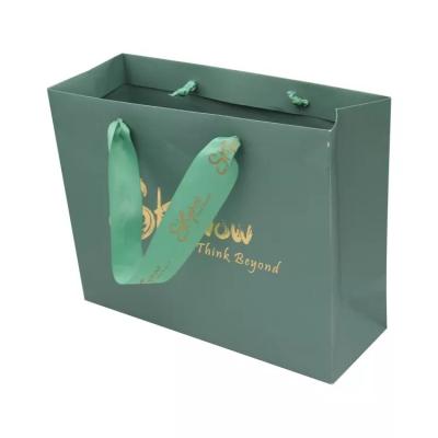 China Boutique Printed Paper Carrier Bags Foldable Reusable With Logo for sale