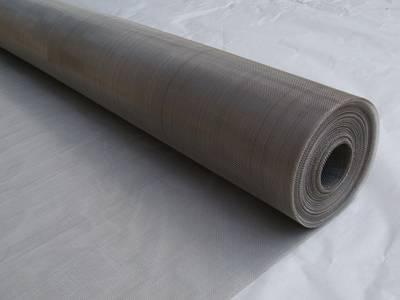 A roll of plain weave 304 stainless steel screen on the gray background.