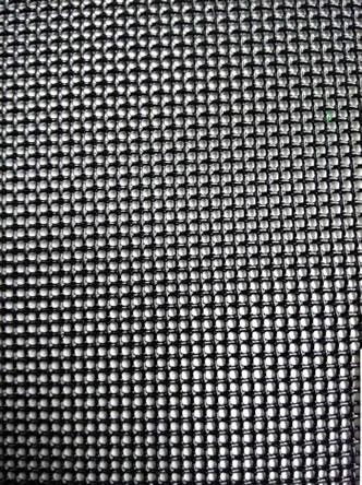 A piece of rectangular black crime safe mesh with uniform mesh holes.