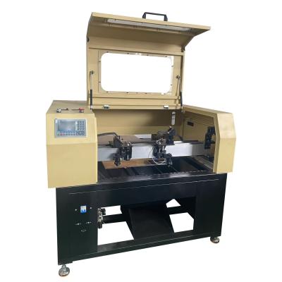 China 150W CO2 Laser Cutting Machine Dual Head Automatic Multi Function Non Metallic Material Processing for sale