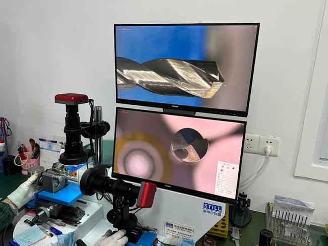 Quality control technician examining carbide burrs