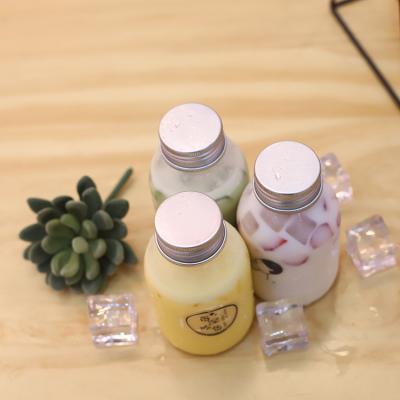 China Plastic Milk Tea Bottles With Handle For Drinking With Material And Efficiency for sale