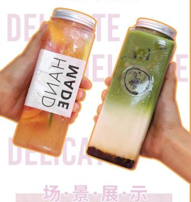 China Customized Plastic Beverage Bottles With Screw On Spouts And Lids for sale