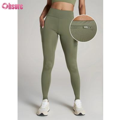 China Textured Sports Leggings Fitness Yoga Sports Pants With Zipper Design Sports Yoga Leggings for Women for sale