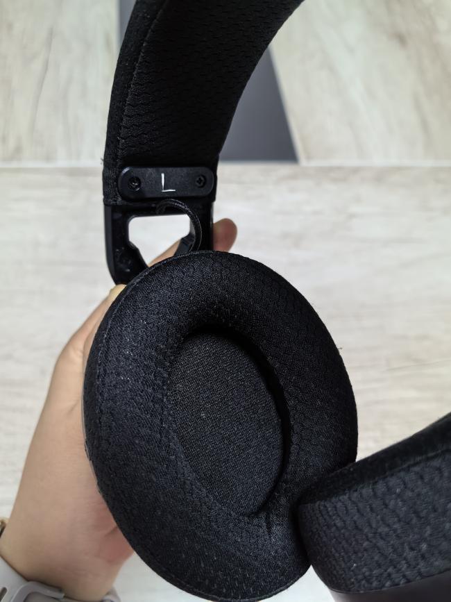 X1 PRO gaming headset close-up of ear cushion and controls
