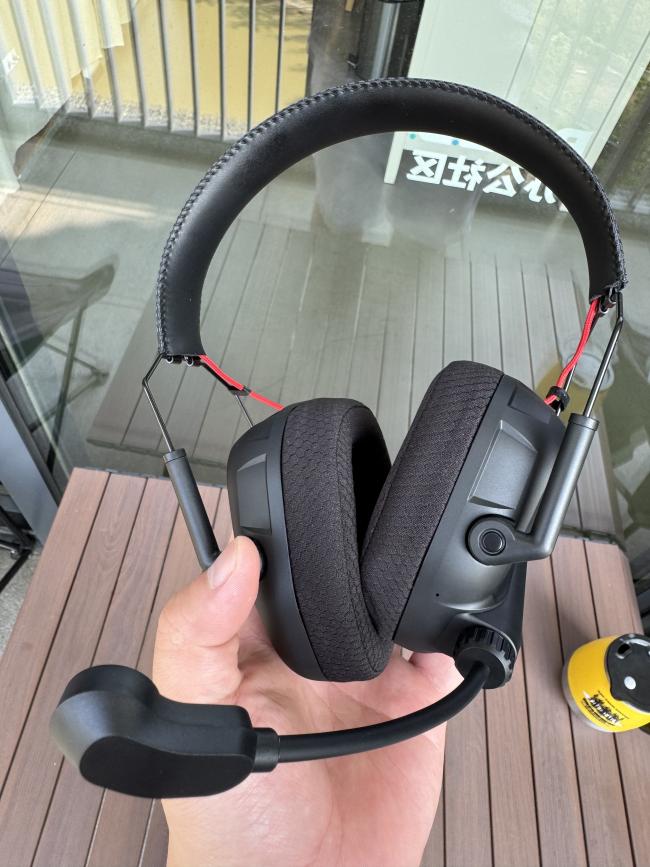 X1 PRO headset side view highlighting adjustable headband and microphone