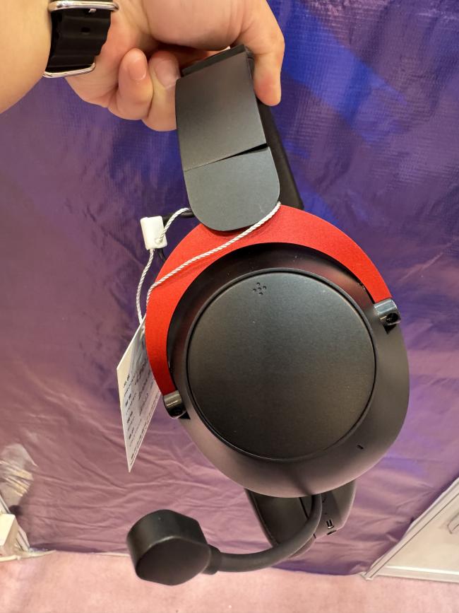 X1 PRO gaming headset close-up of ear cushion and controls