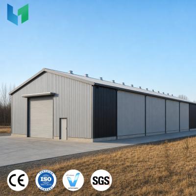 China Steel Structure Warehouse Prefabricated Storage Building with Mezzanine Office and Double Roller Shutter Doors for Logistics for sale