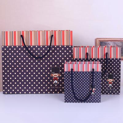 China Customised cheap paper bag for children's clothing packaging shopping bags for sale