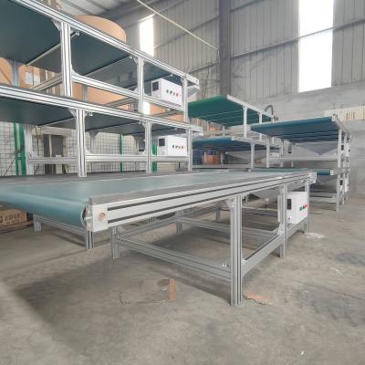 China Projeto de máquina de roteador CNC de alimentação e descarga automática com plataforma transportadora à venda