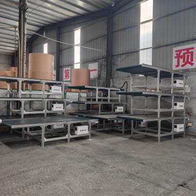China Projeto de máquina de roteador CNC de alimentação e descarga automática com plataforma transportadora à venda