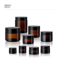 Quality Round Cosmetic glass jars offering thick glass durability free sample support for sale