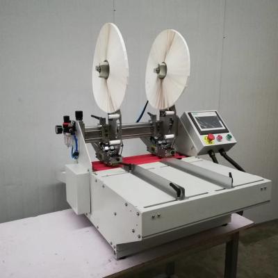 中国 2つのアプリケーターが付いている紙テープアプリケーター機械粘着テープ機械 販売のため