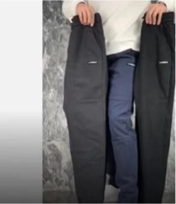 China Flat Front Style Mens Cargo Pants InStock with Custom Buttons Loose Fitness Joggers for sale