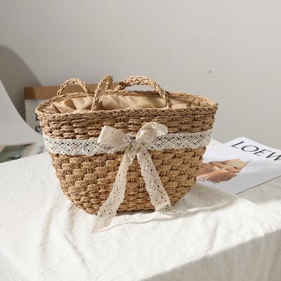 China Open Closure Customized Color Straw Bag Lace Bow Woven Bag for Seaside Vacation Beach Women for sale