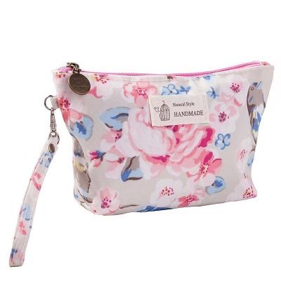 Cina Borsa con cerniera a stampa floreale Borsa di trucco floreale carina per organizzare gli elementi essenziali della bellezza in vendita