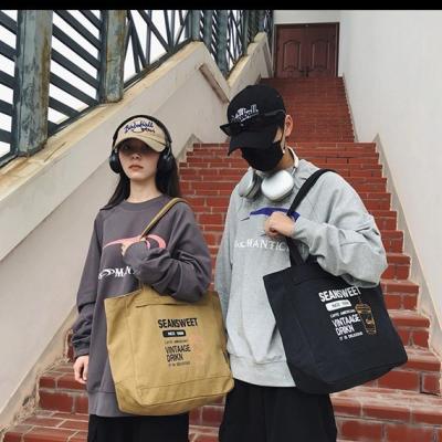 중국 주머니 가 있는 중형 토트 핸드백 판매용