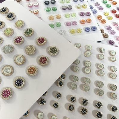 China wholesale large quantity  plastic shirt coat button shine stone button for garment for sale
