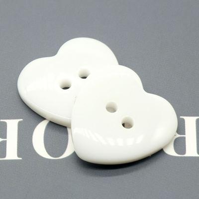 China wholesale DIY fancy children Heart-shaped button resin 2 holes shirt trench coat button for sale