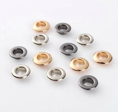China wholesale ready goods 300# 10mm High quality Shiny Gold brass flat eyelet grommets for sale