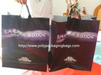 China Black Soft Flexible Loop Handle Plastic Bags With Custom Printing for sale