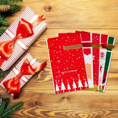 Cina Borse del regalo di natale del cordone di CBE di stampa 0.06mm di CMYK in vendita