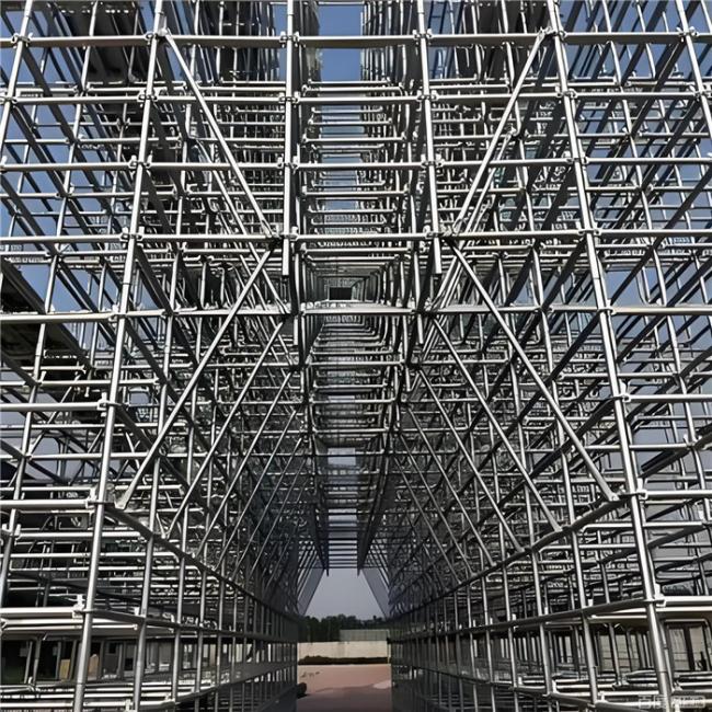 Multiple galvanized step boards stacked for storage and transport