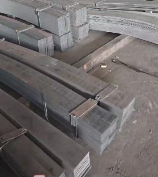 Neatly stacked prime cold rolled steel sheets ready for export shipping.