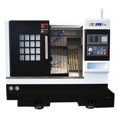 Cina Slant Bed Metal Cnc Lathe Machine High Presion Overall 45° Bed Form And Slope in vendita